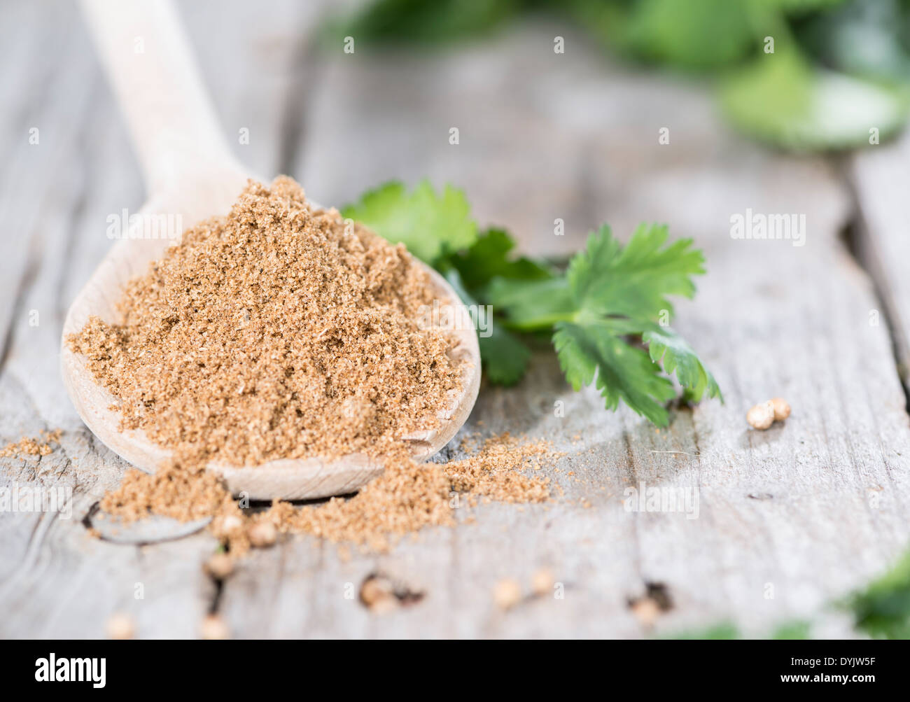 Small Portion of Coriander Powder on a wooden spoon Stock Photo - Alamy