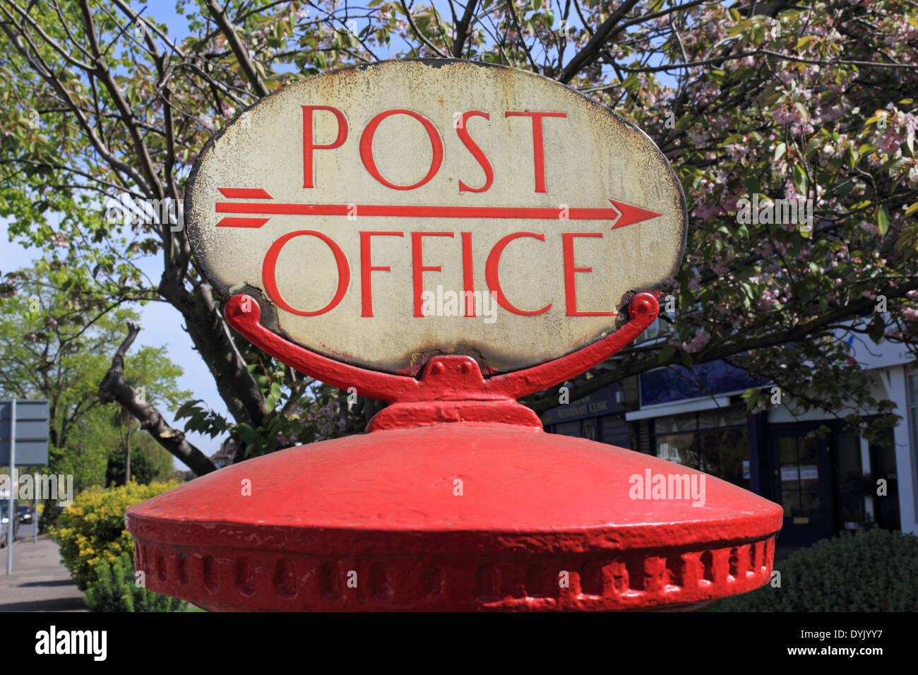Traditional old fashioned Post office sign and arrow on top of postbox ...