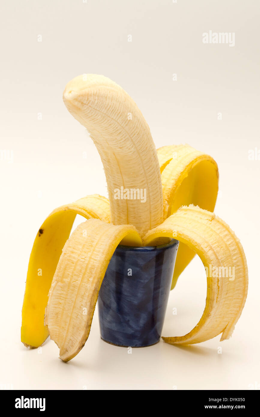 single open banana in small pot isolated on white background Stock ...