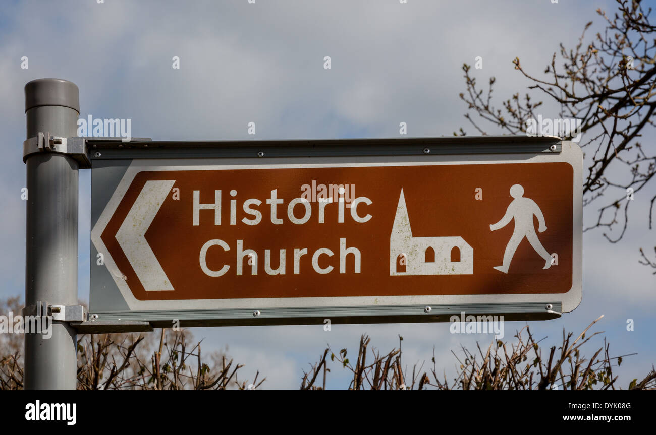 Sign pointing towards Historic Church Stock Photo - Alamy