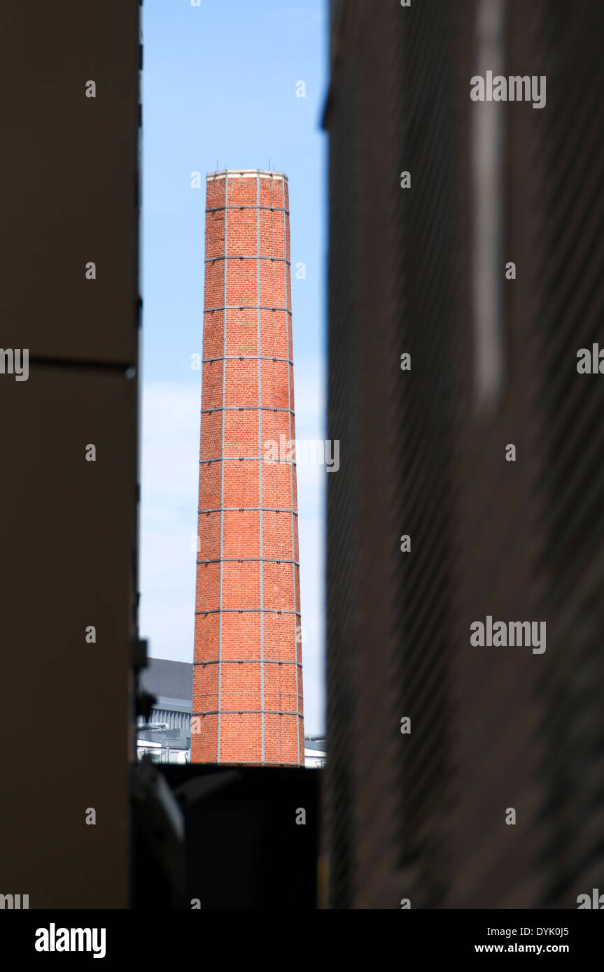 Chimney of the former Chorlton Mill seen through a gap in the Parkway ...