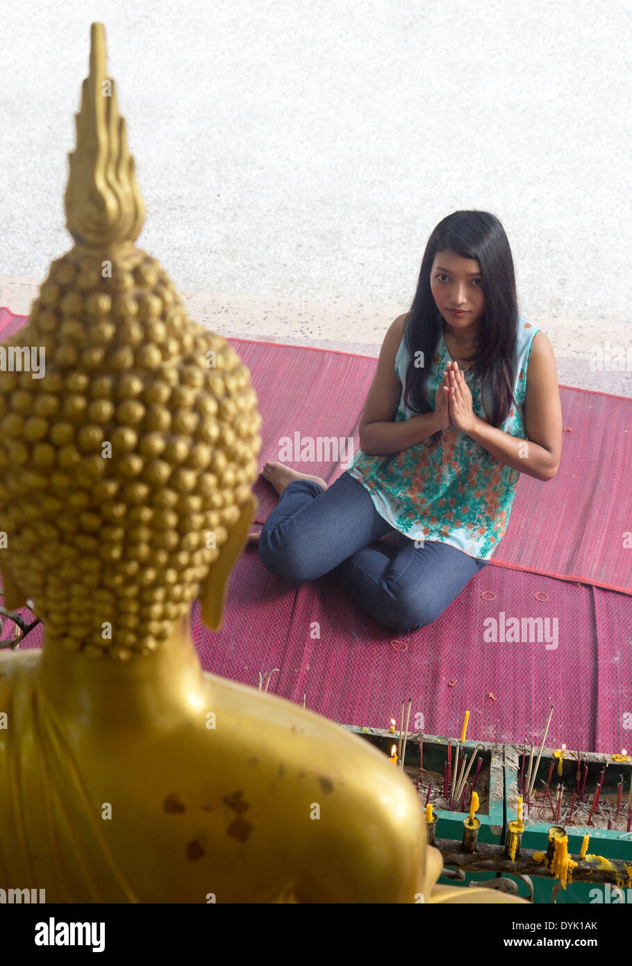 Woman meditate buddha statue hi-res stock photography and images - Alamy