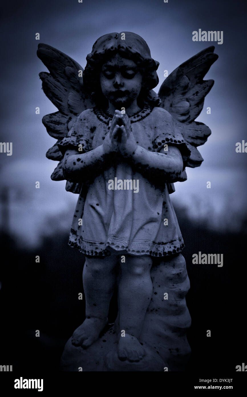 Blue gothic angel statue praying hi-res stock photography and images ...