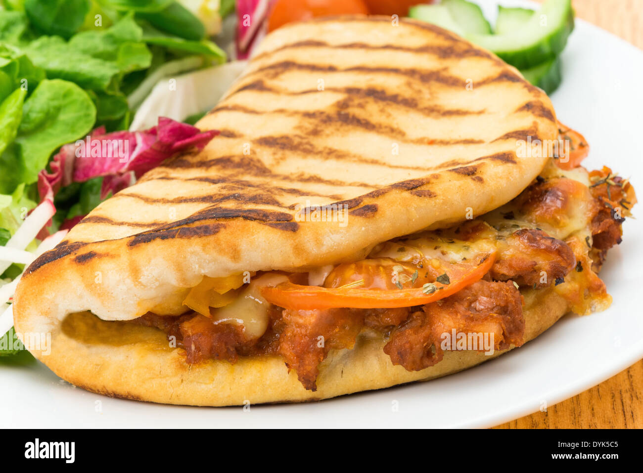 A barbecue pulled pork flatbread panini and salad - studio shot Stock ...