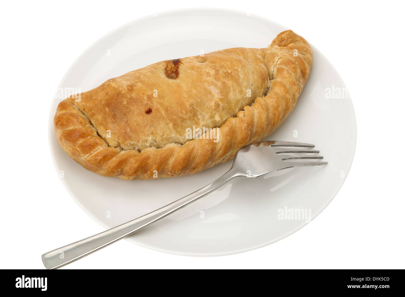 Traditional Cornish pasty served on a white plate with a fork - white ...