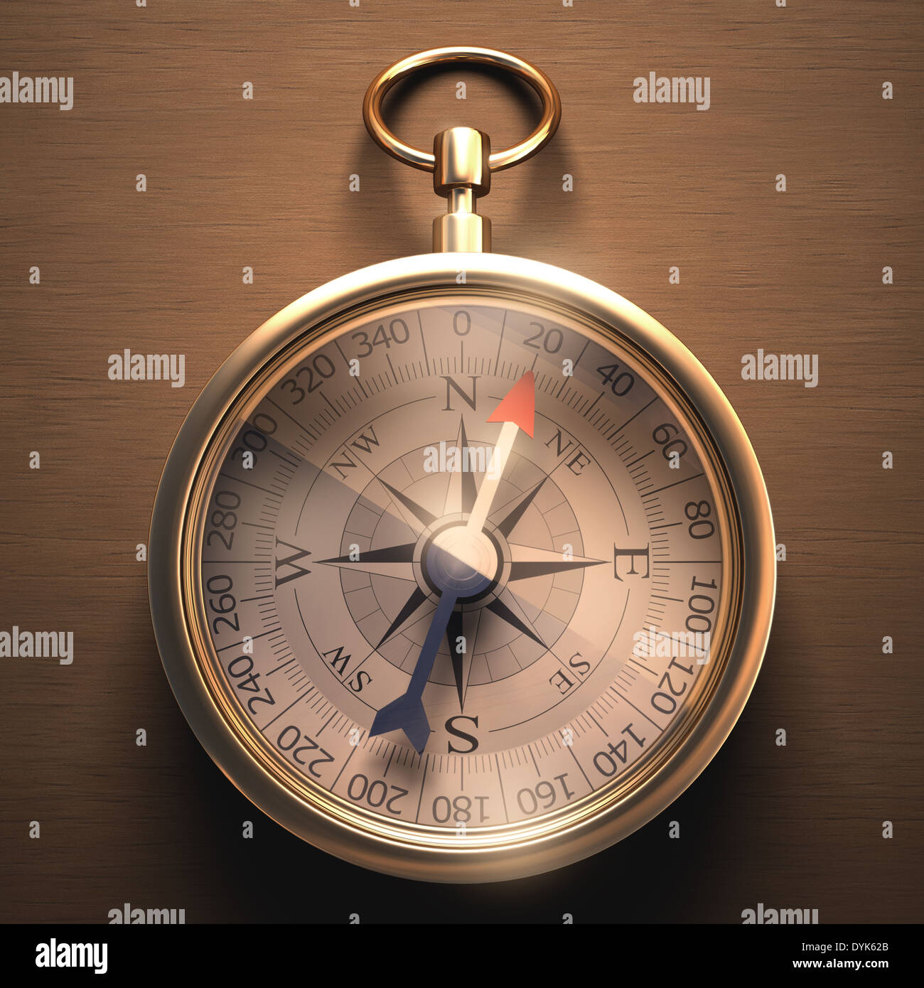 Compass on a wooden table with clipping path included Stock Photo - Alamy