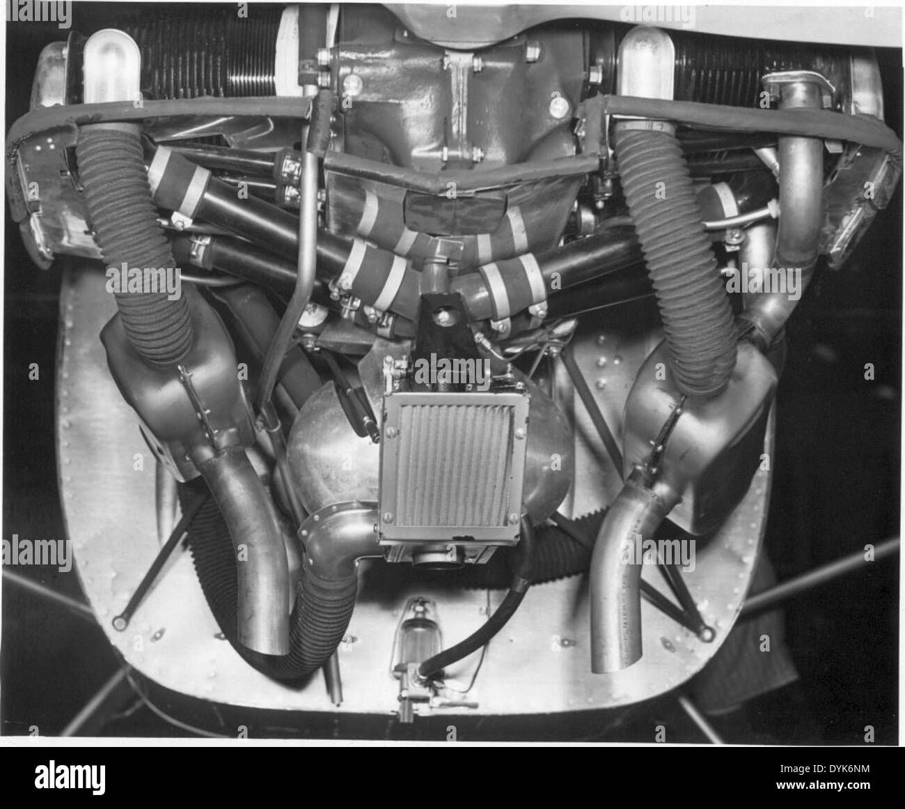 This photo features Mort Brown, a test pilot for Cessna, inspecting a ...