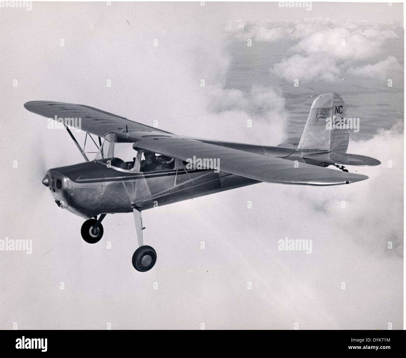 This image shows Mort Brown, a test pilot, flying a Cessna aircraft ...