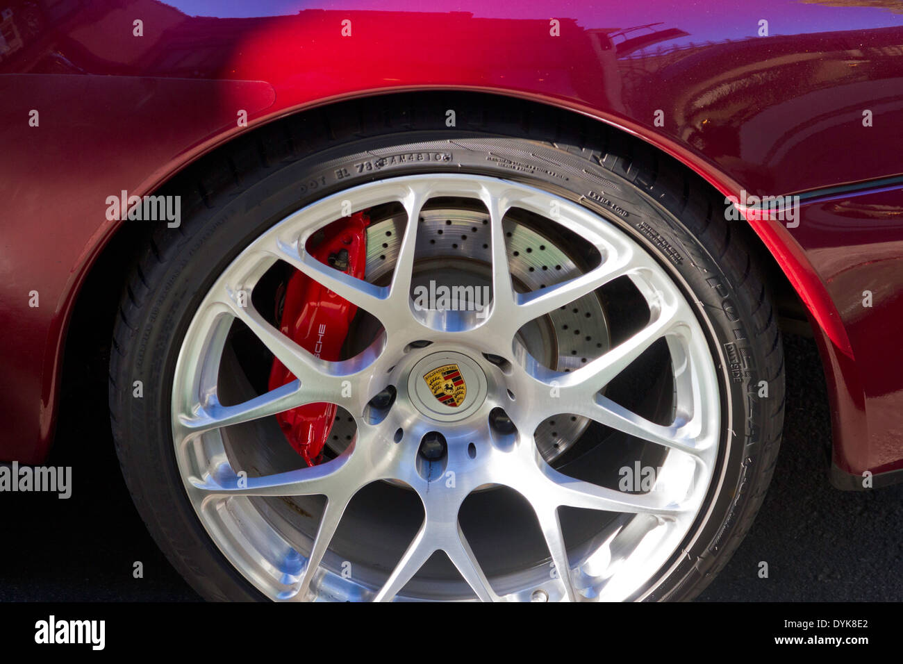 Closeup view of wheel, tire, and brakes of a red Porsche Stock Photo ...