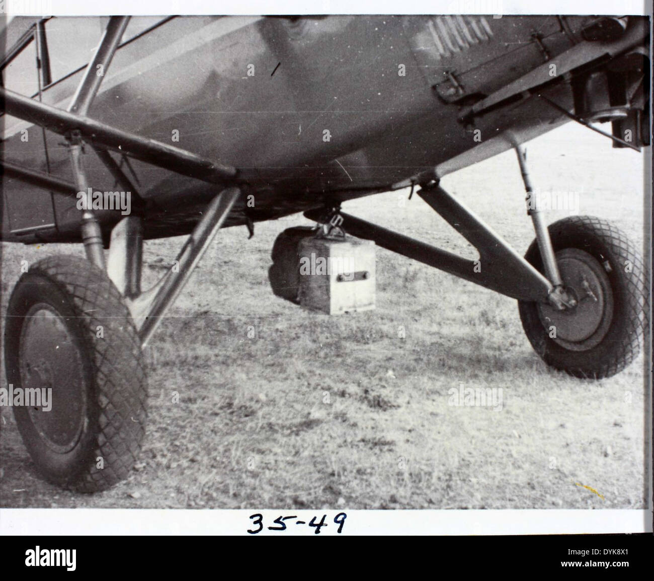 This photo demonstrates the attachment of a parachute and weight to a ...