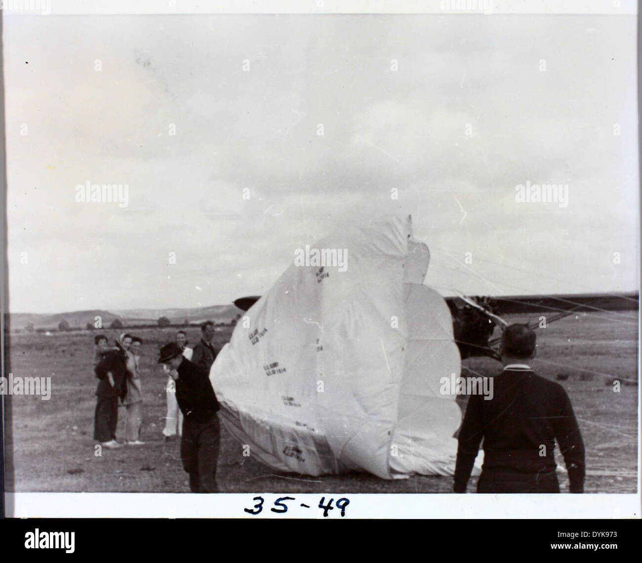 This photograph shows a parachute and its weight after a test drop by ...