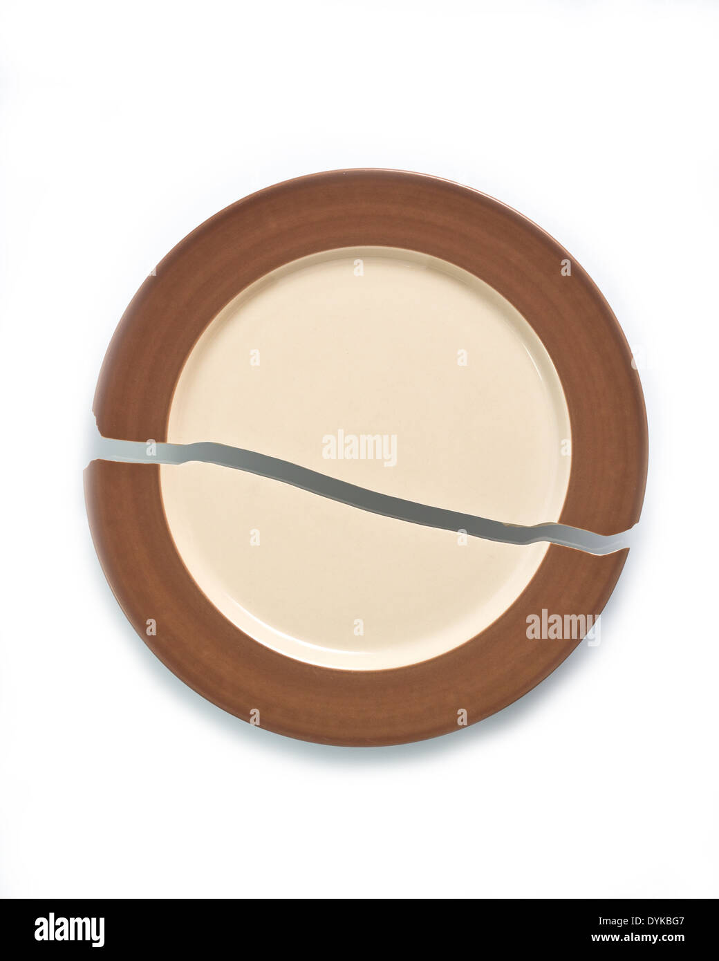 Broken round dish on isolated white background Stock Photo - Alamy