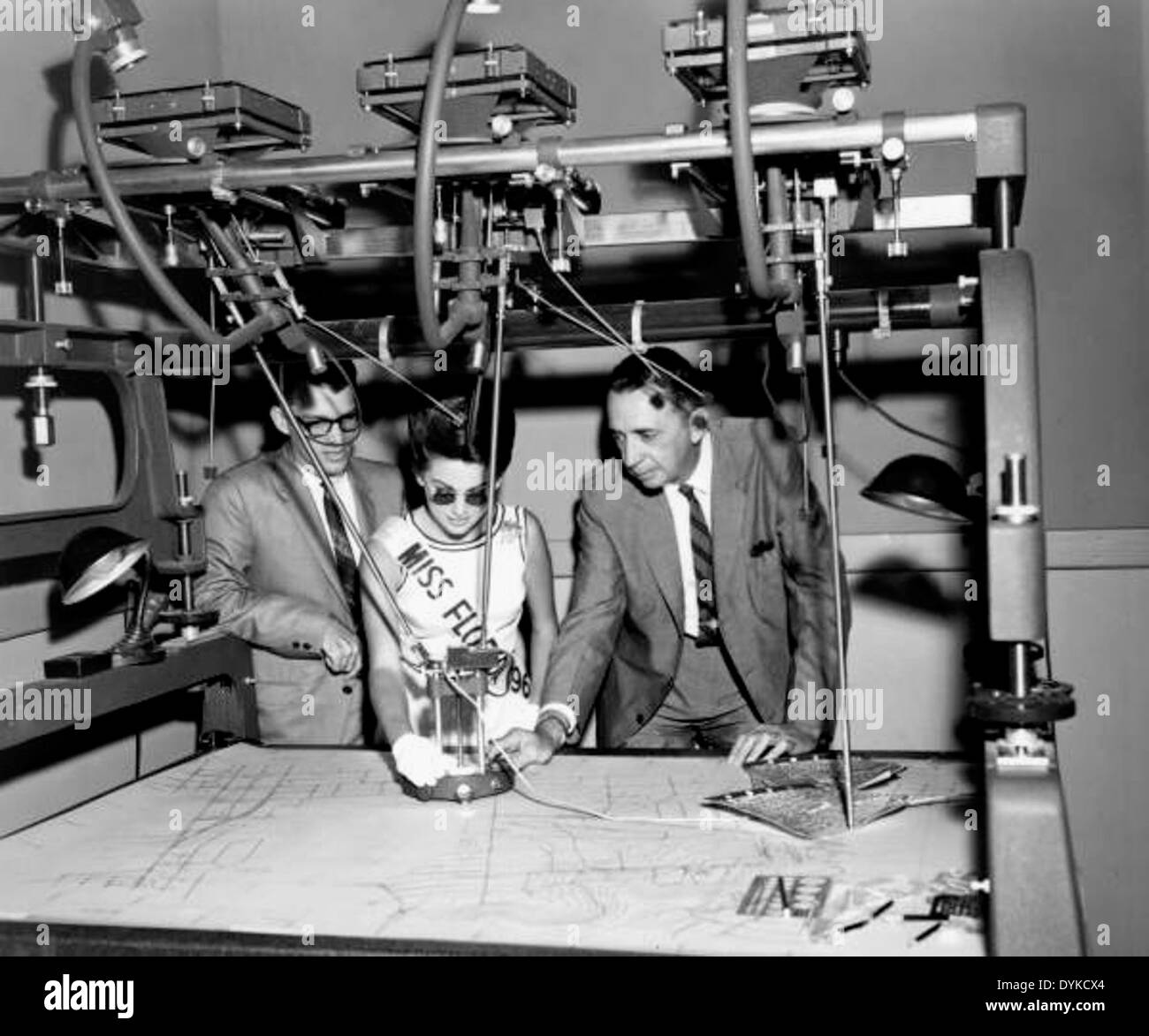 Miss Florida 1965, Carol Blum, assists in marking key locations as part ...