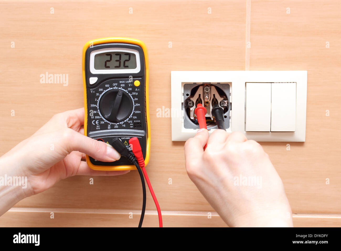 Hand electrician with multimeter checking voltage Stock Photo - Alamy