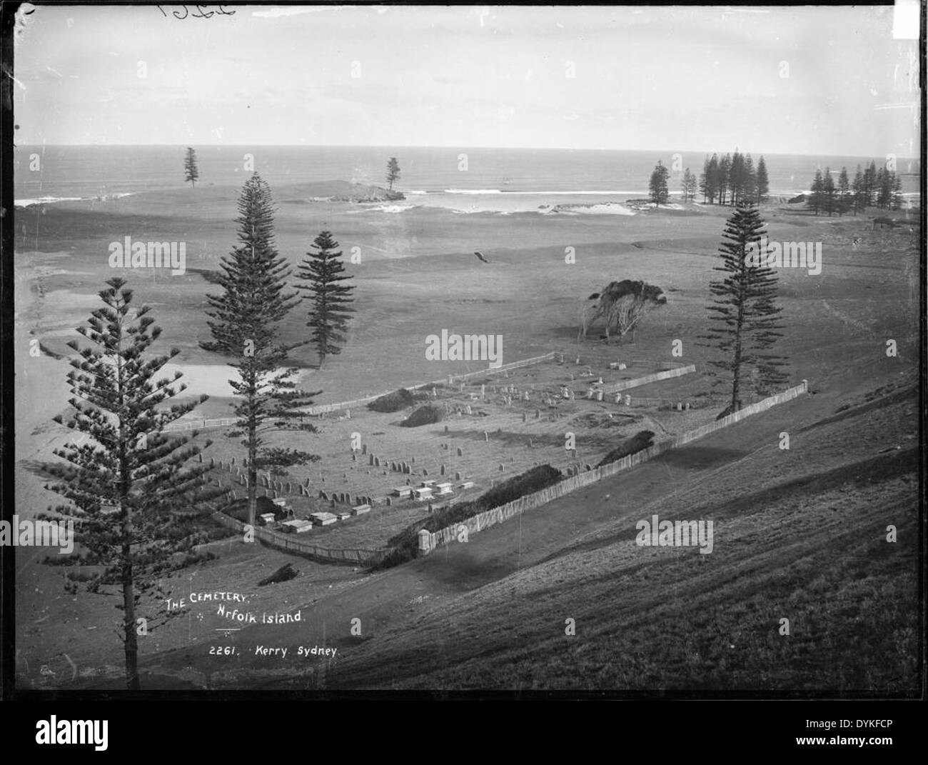 This image depicts a historical view of the cemetery on Norfolk Island ...