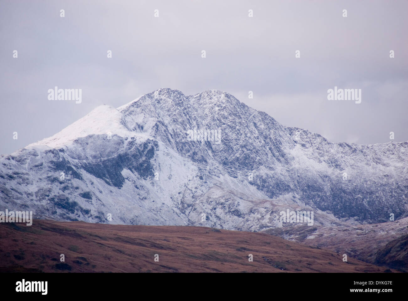 Snow covered mount Snowdon on a cloudy winter morning, Snowdonia Circle ...