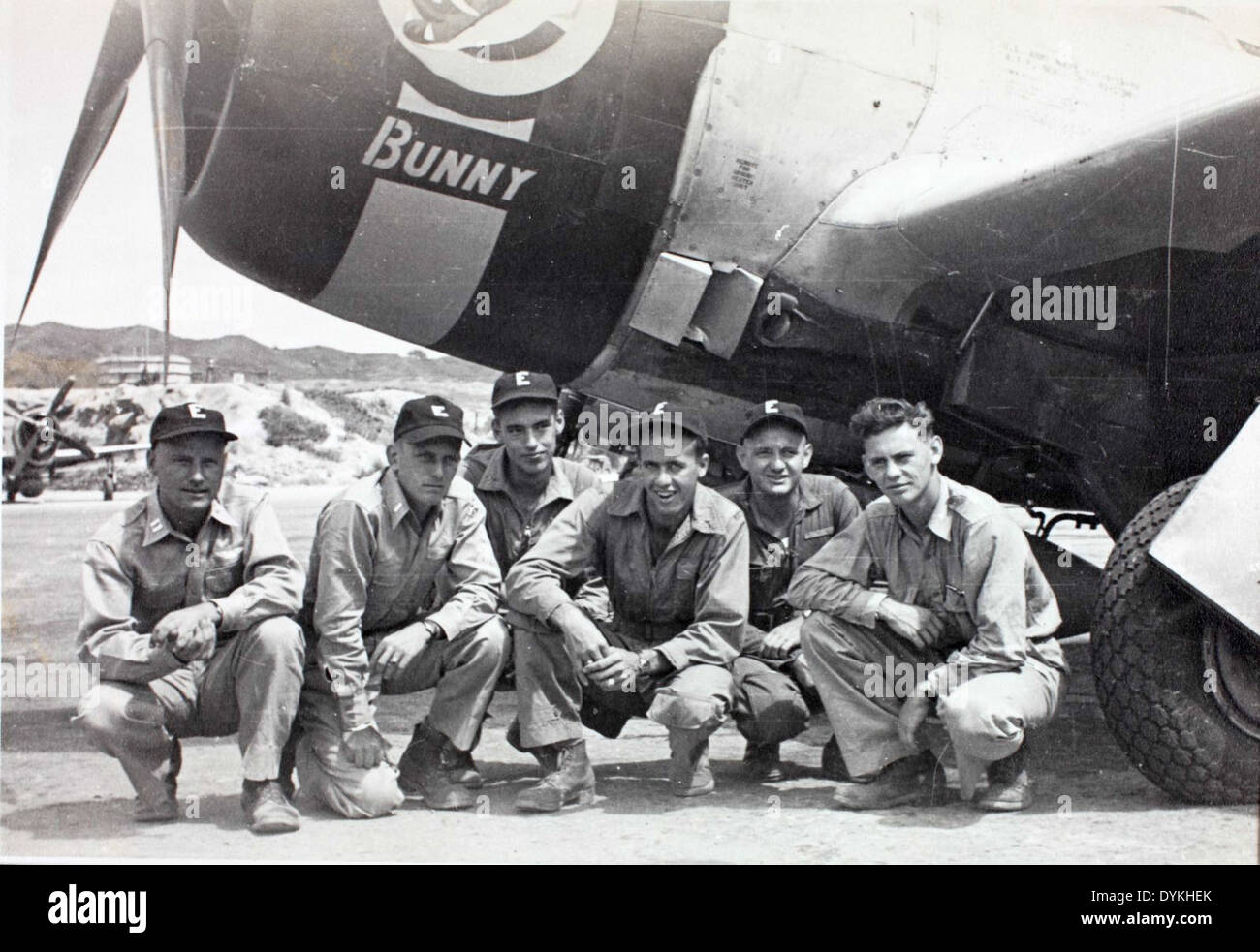 This photo features pilots standing in front of their aircraft ...