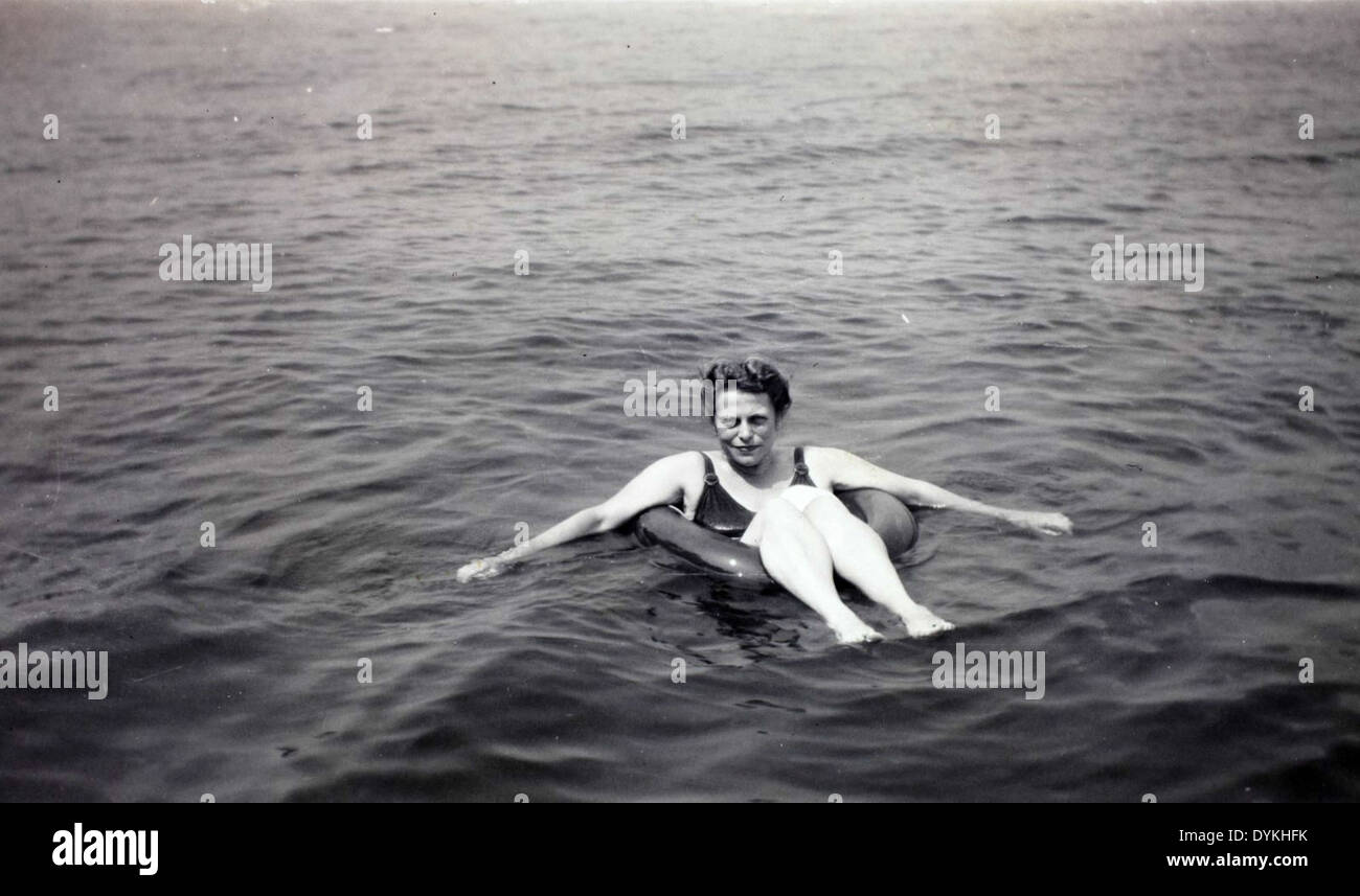 Unidentified woman floating in water Stock Photo - Alamy