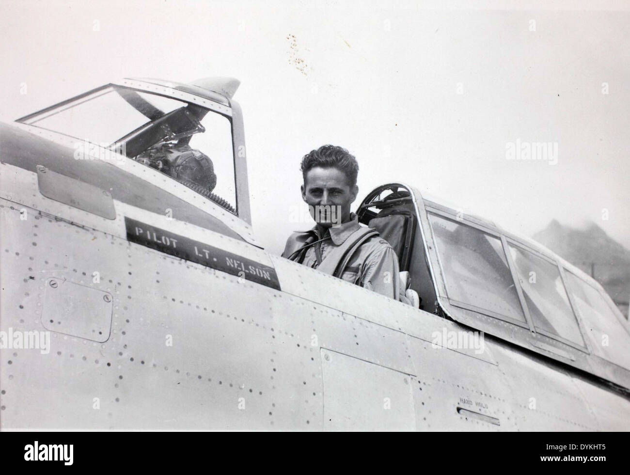 This photograph captures an aviator named Nelson in the cockpit of an ...