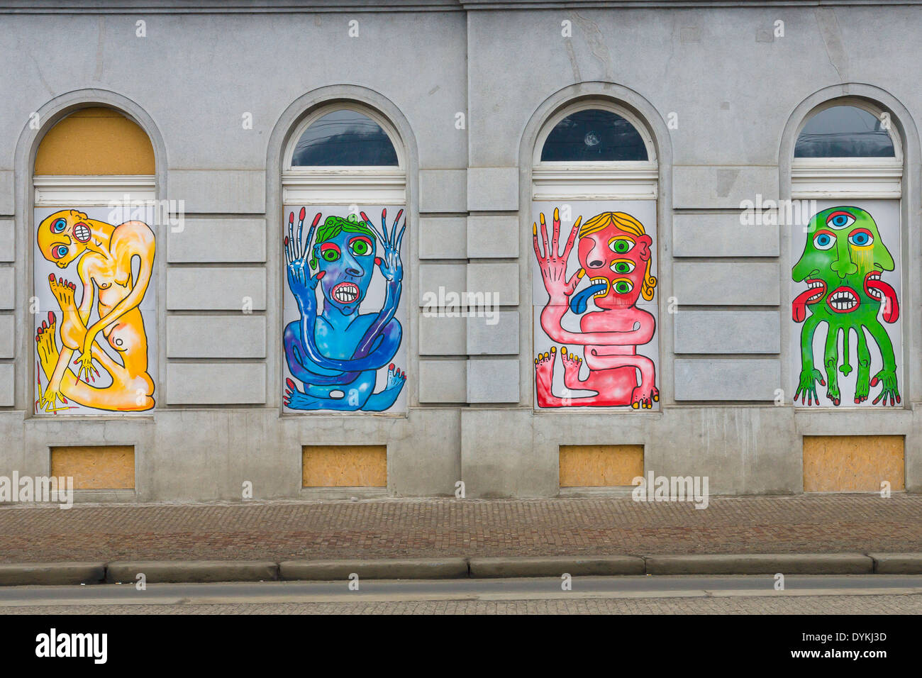 Modern graffiti in the windows of old houses in Prague. Prague is the ...