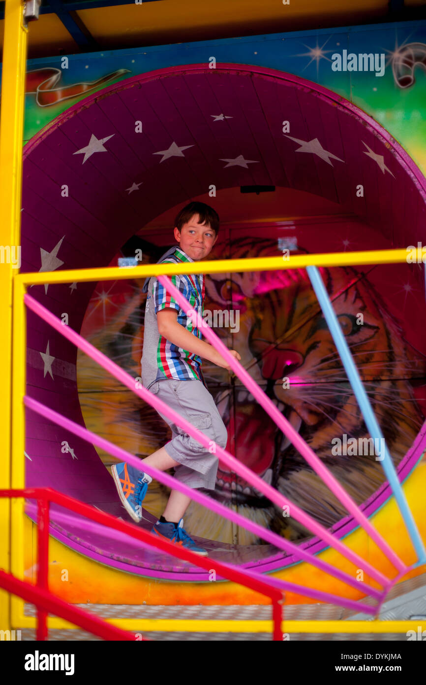 Child on colorful fair attraction having fun Stock Photo - Alamy