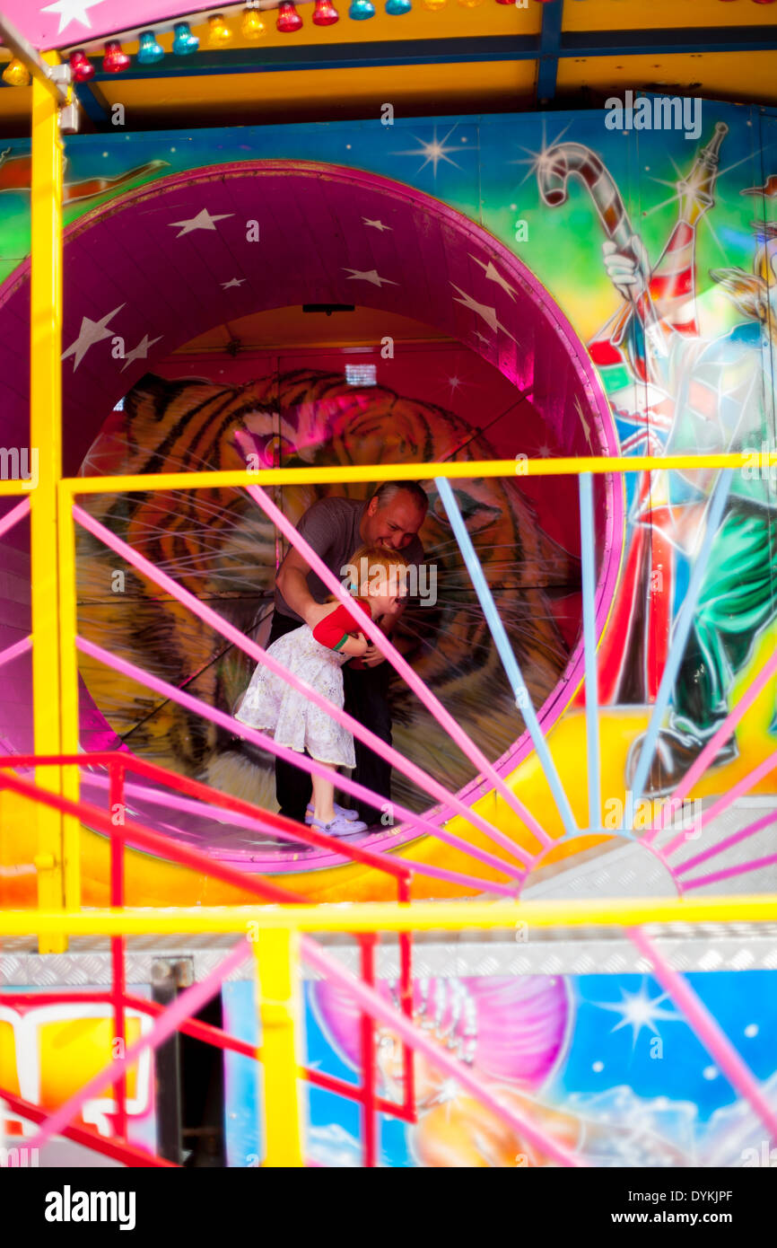 Child on colorful fair attraction having fun Stock Photo - Alamy