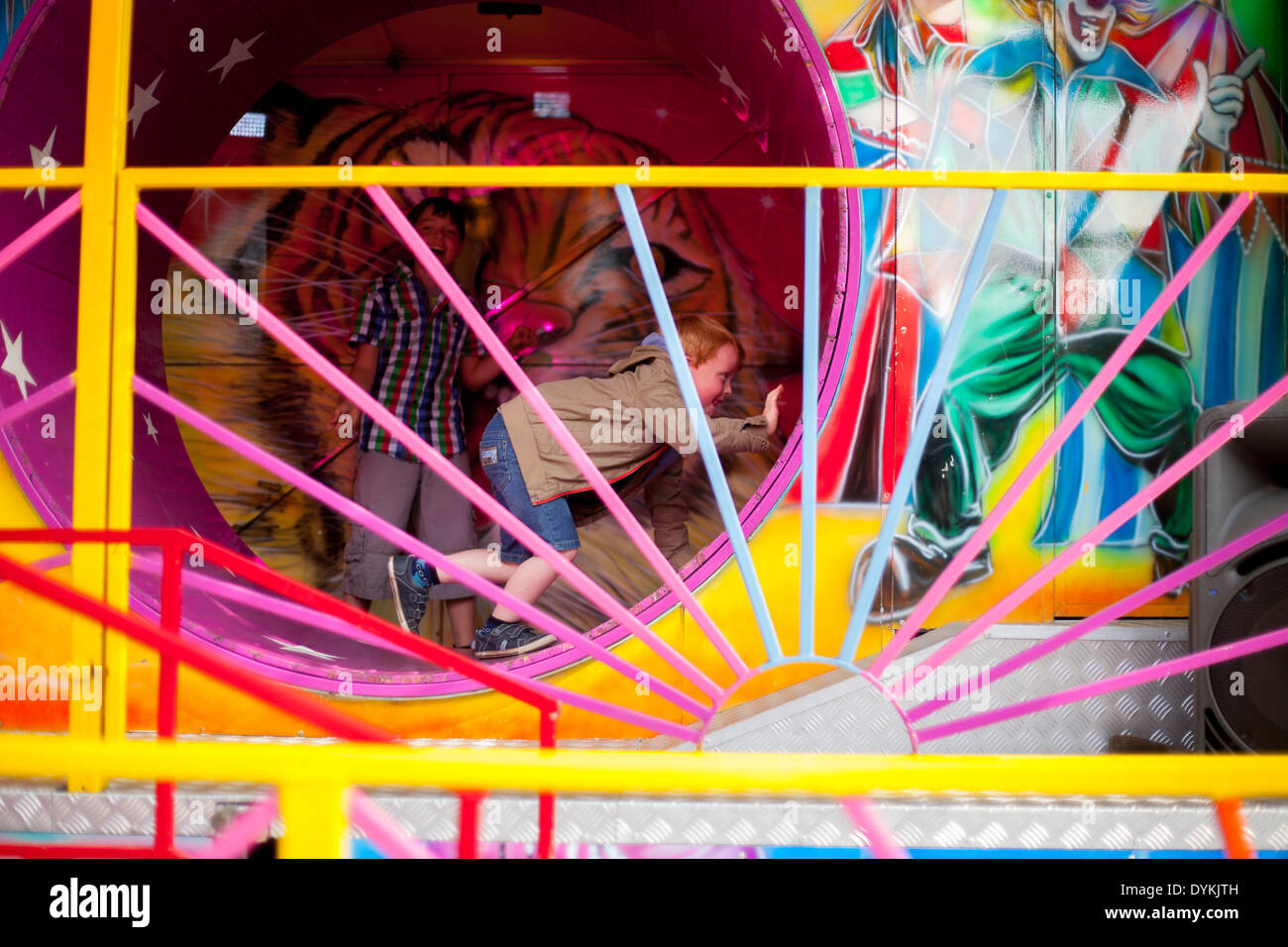 Child on colorful fair attraction having fun Stock Photo - Alamy
