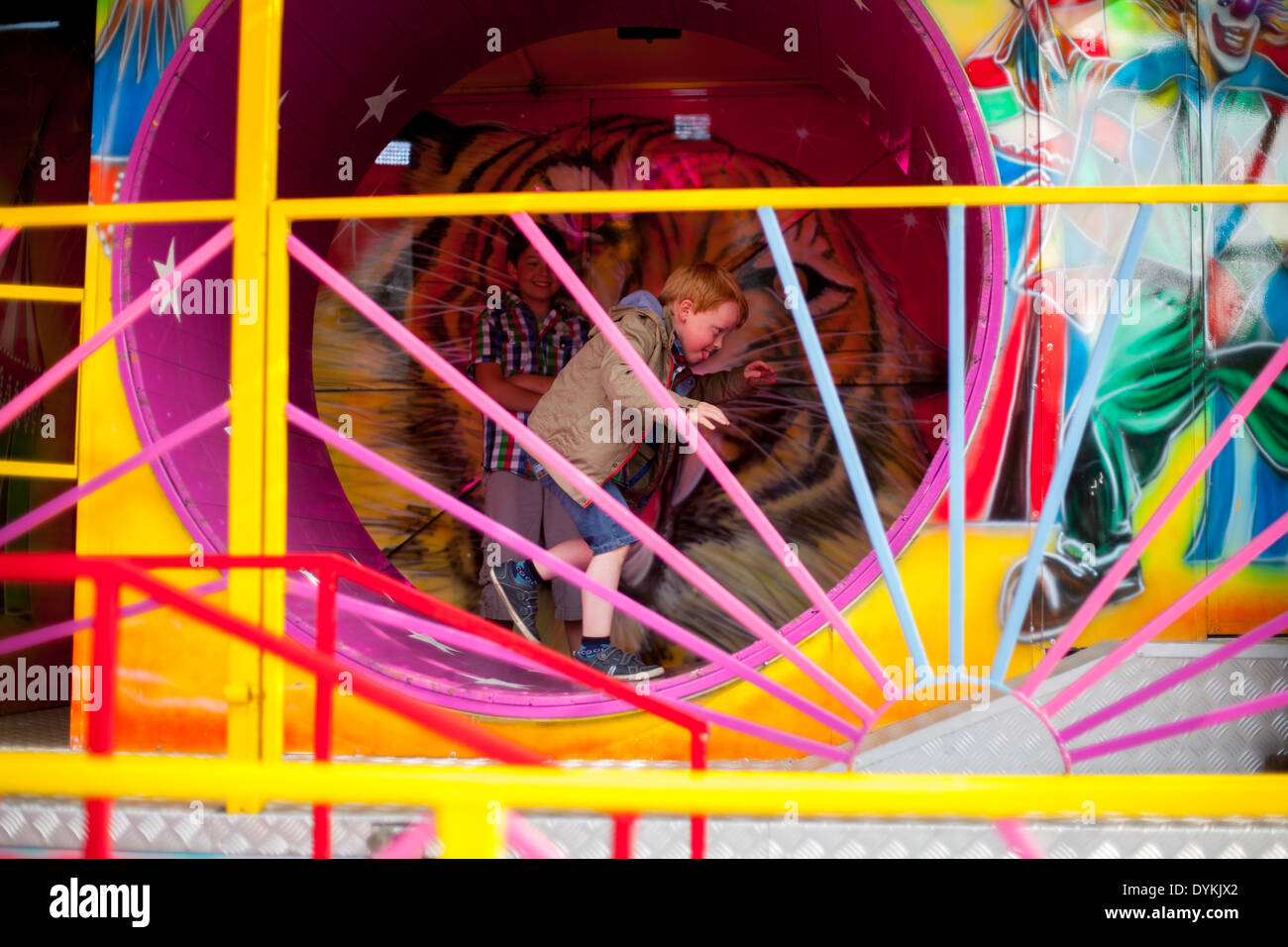 Child on colorful fair attraction having fun Stock Photo - Alamy