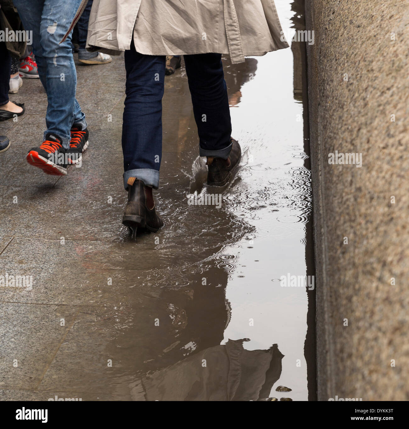 London, UK. 21st Apr, 2014. People trying to avoid the water ...