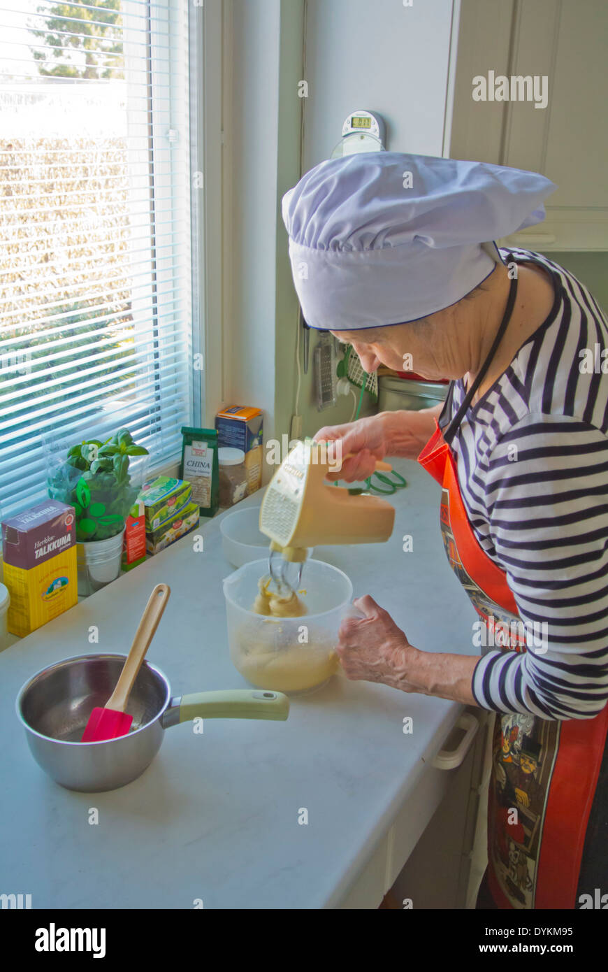 Whisking dough during baking, Finland, Europe Stock Photo - Alamy