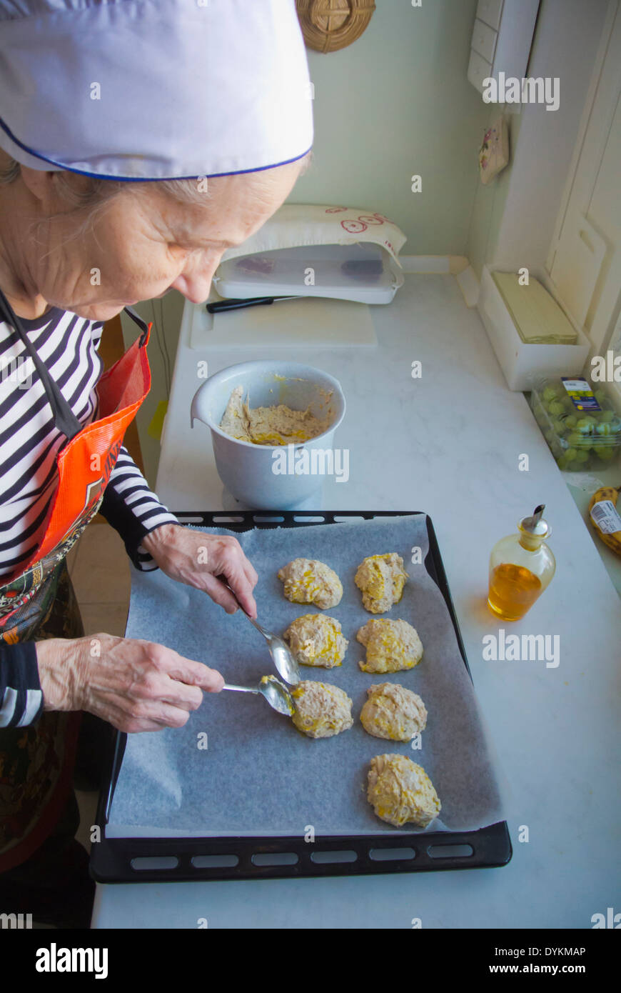 Forming bread rolls out of risen raw dough while baking, Finland ...