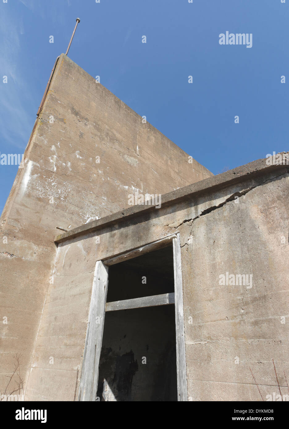 Abandoned and decaying concrete building exterior and blue sky Stock ...