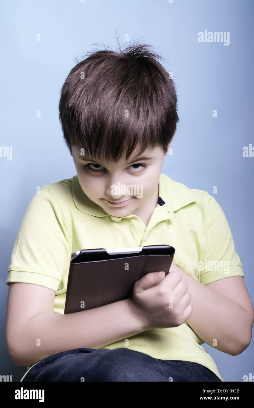 young boy with a tablet Stock Photo - Alamy
