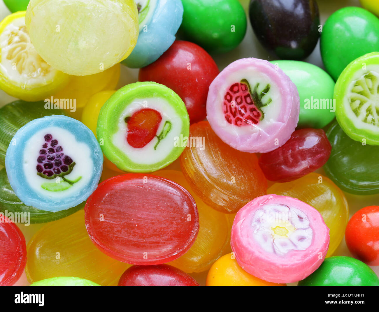 colored caramel fruit candies on a white background Stock Photo - Alamy