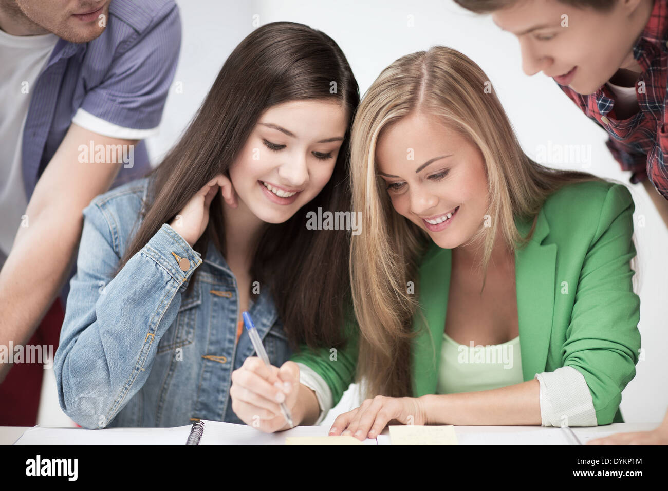 students pointing at notebook at school Stock Photo - Alamy
