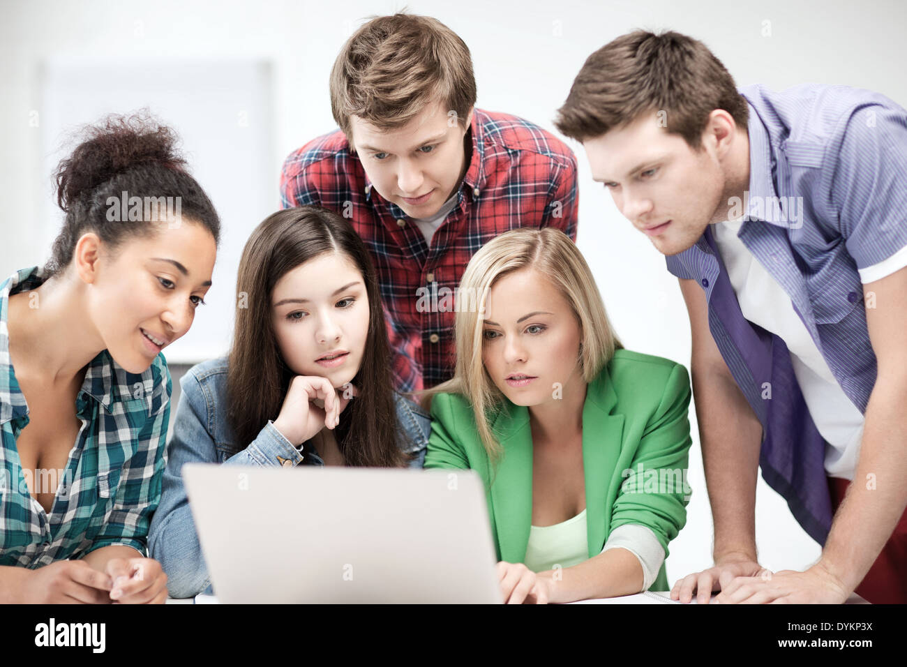 international students looking at laptop at school Stock Photo - Alamy