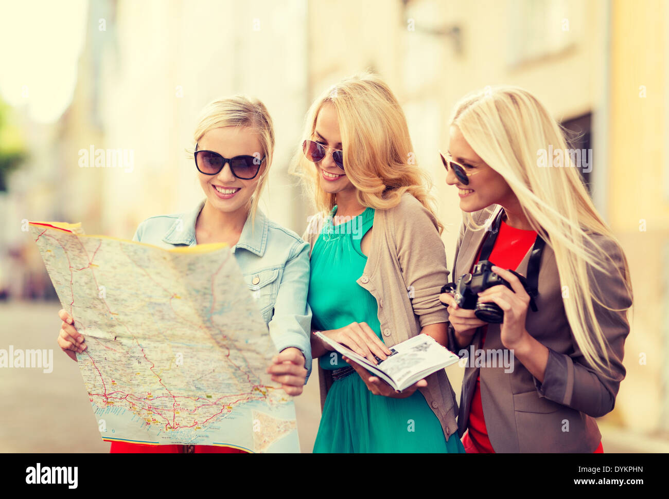 beautiful women with tourist map in the city Stock Photo - Alamy