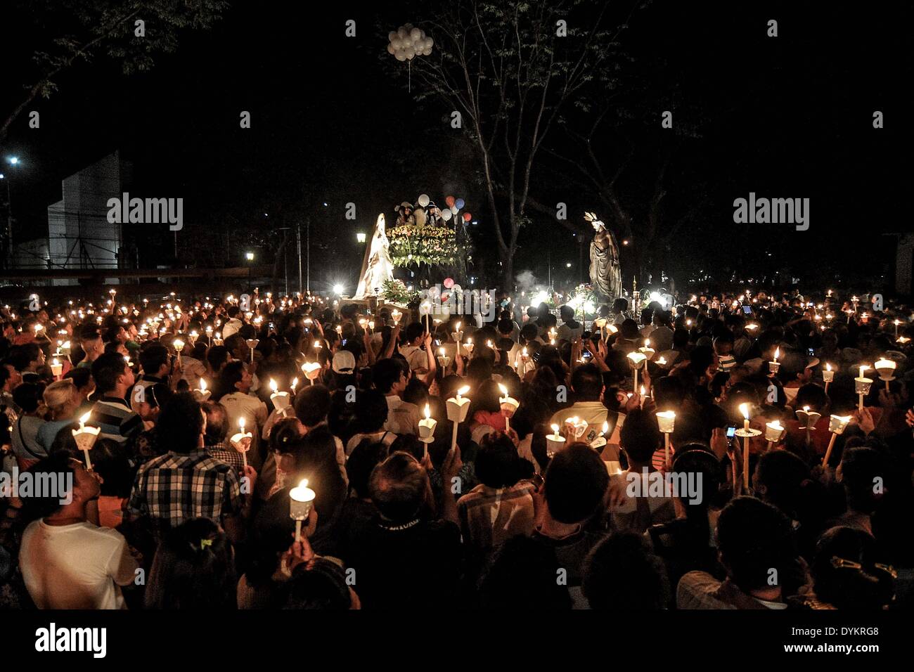 Quezon, Philippines. 20th Apr, 2014. Filipino Catholics witness the ...
