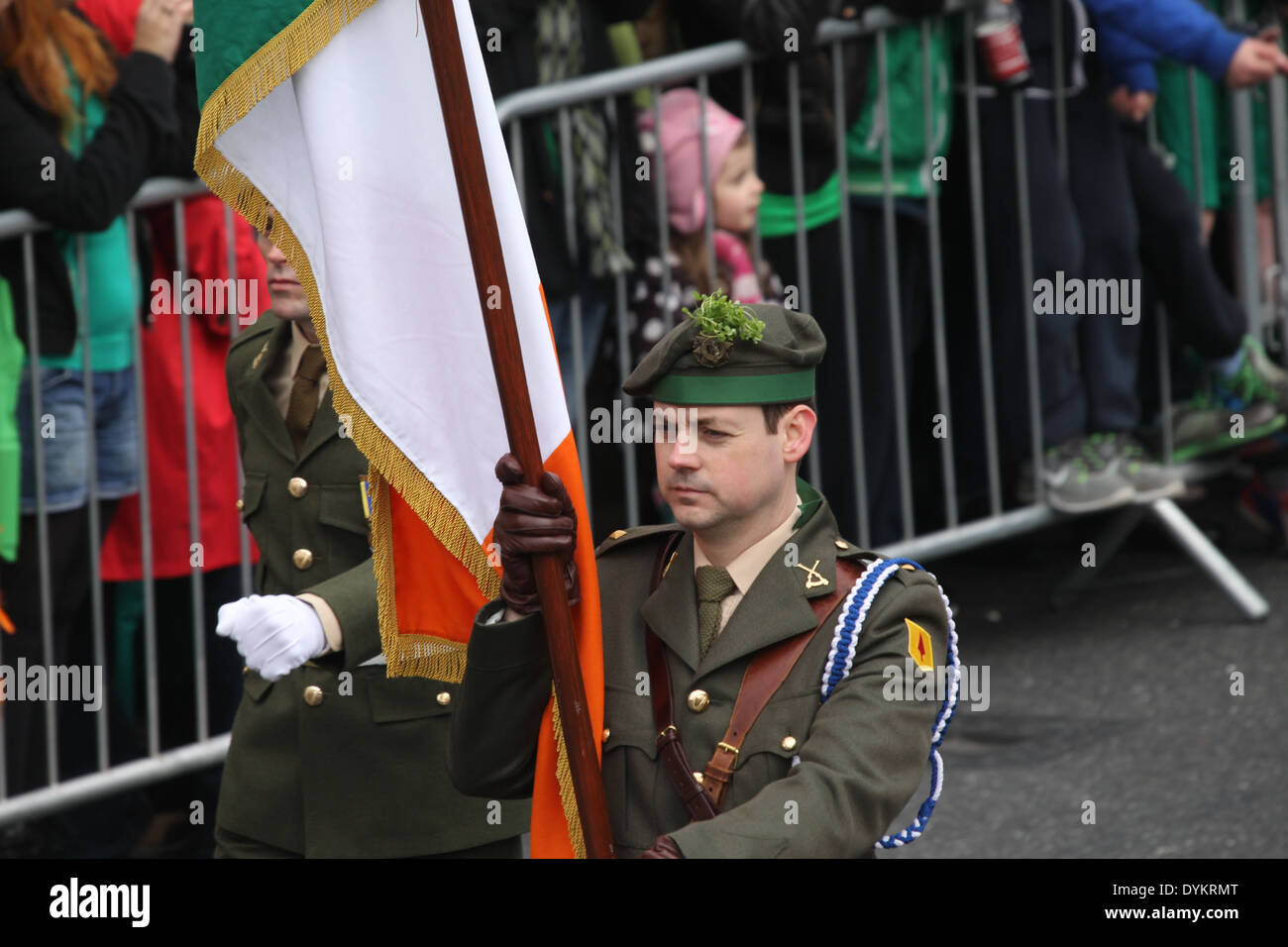 A member of the Irish Defence Force holds up the Irish Tricolour during ...