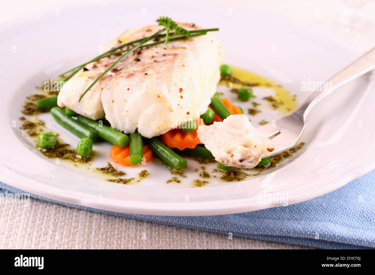 Cod Fillet with green beans, peas, parsley, olive oil Stock Photo - Alamy