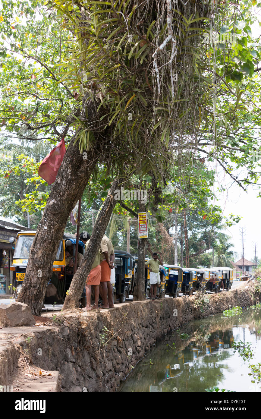 Auto Rickshaws parked by a waterway in the Backwaters of Kerala in ...
