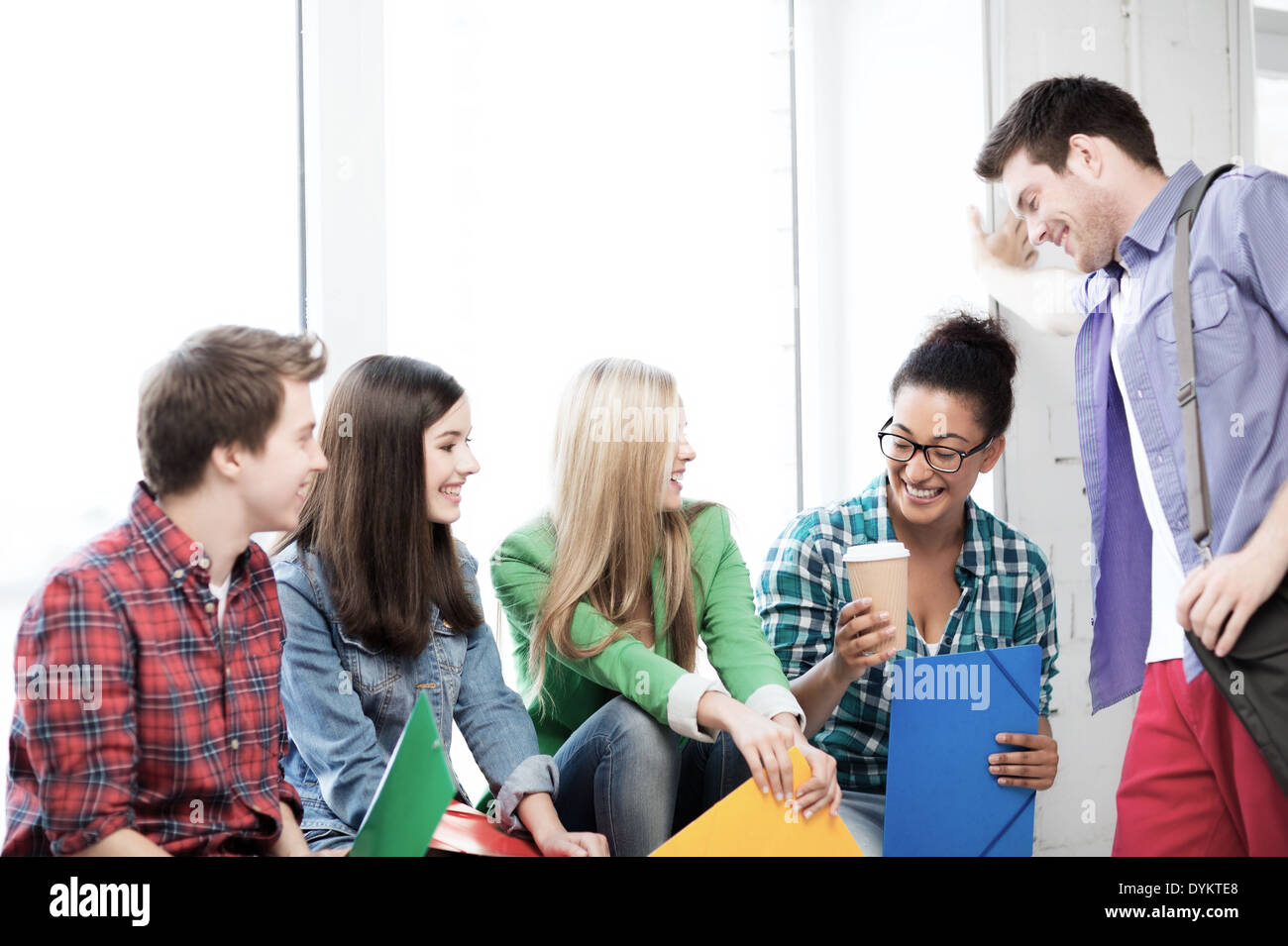 students communicating and laughing at school Stock Photo - Alamy