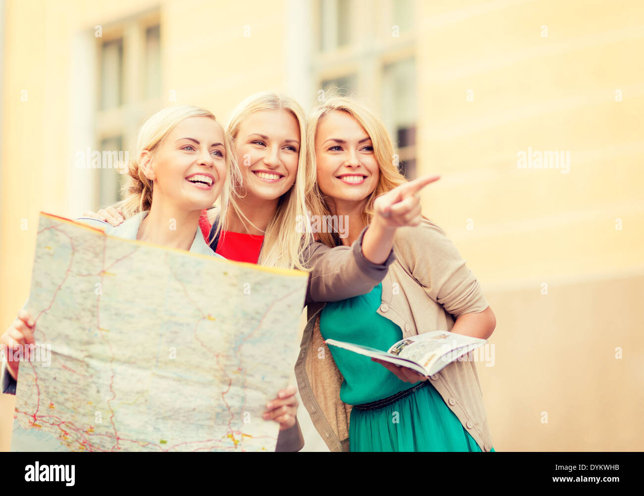 beautiful women with tourist map in the city Stock Photo - Alamy