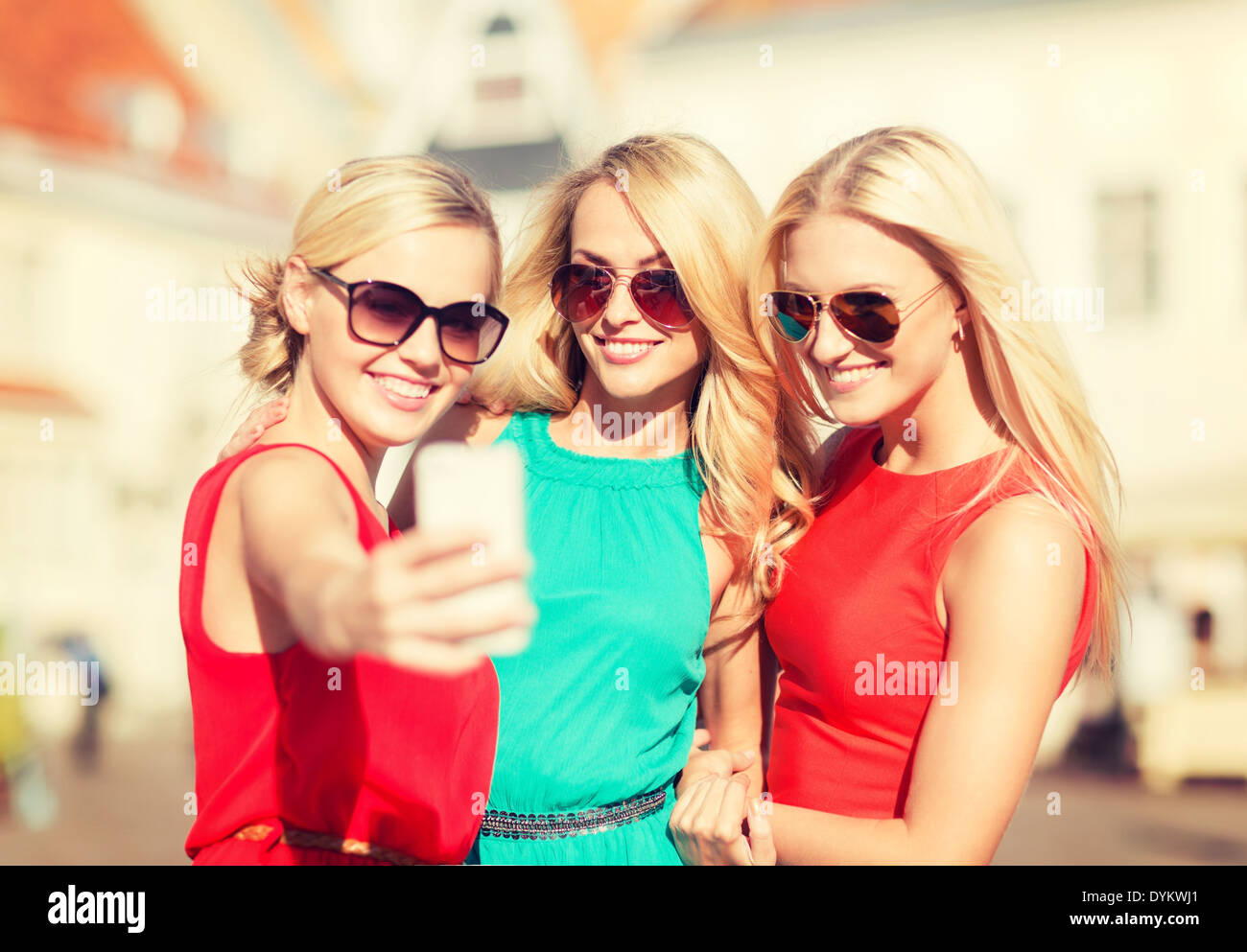 beautiful girls taking picture in the city Stock Photo - Alamy