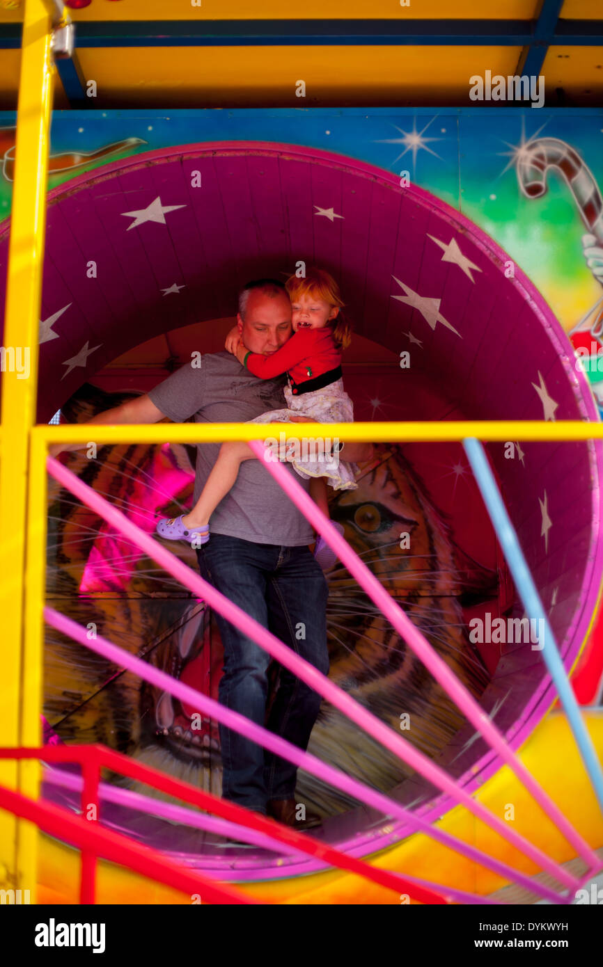 Child on colorful fair attraction having fun Stock Photo - Alamy