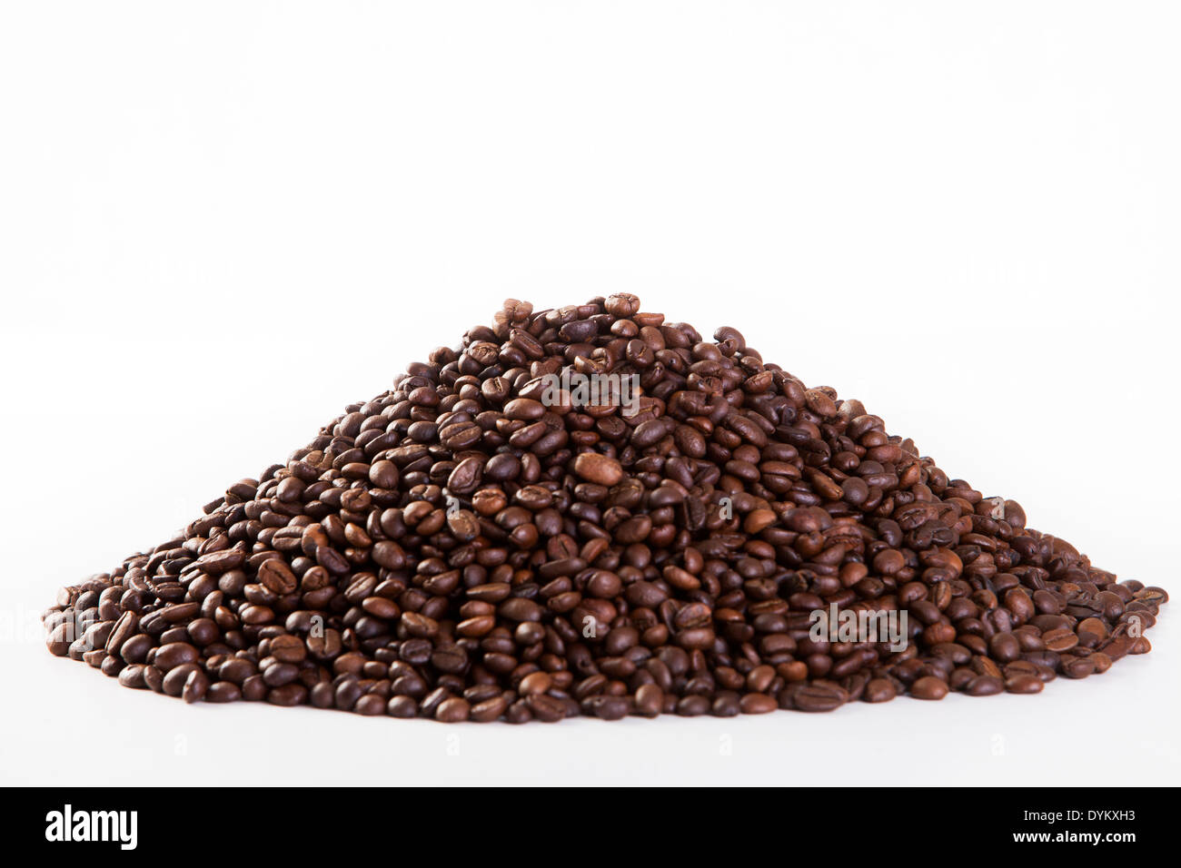 Mountain of roasted coffee beans isolated on white background overhead ...