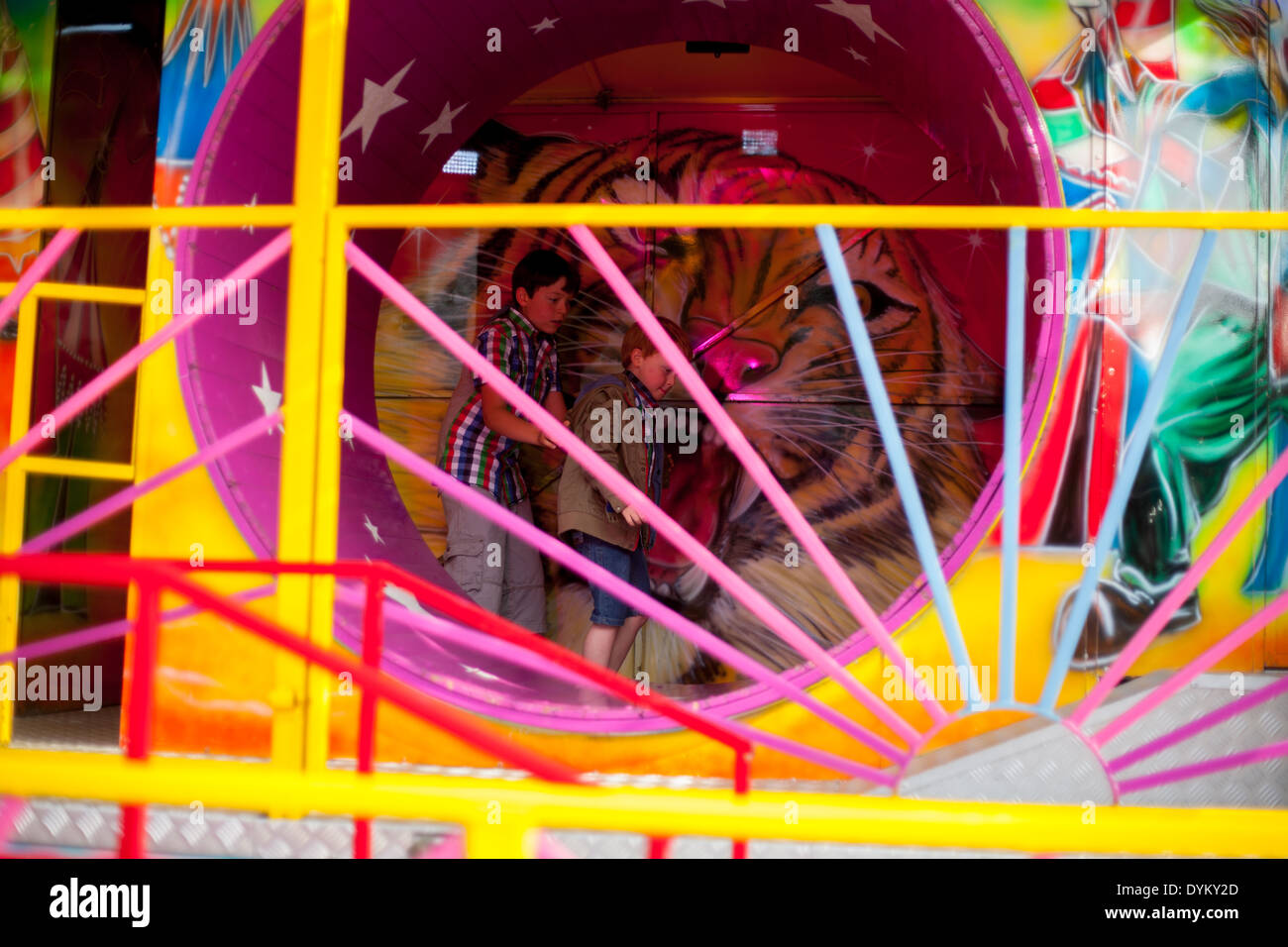 Child on colorful fair attraction having fun Stock Photo - Alamy