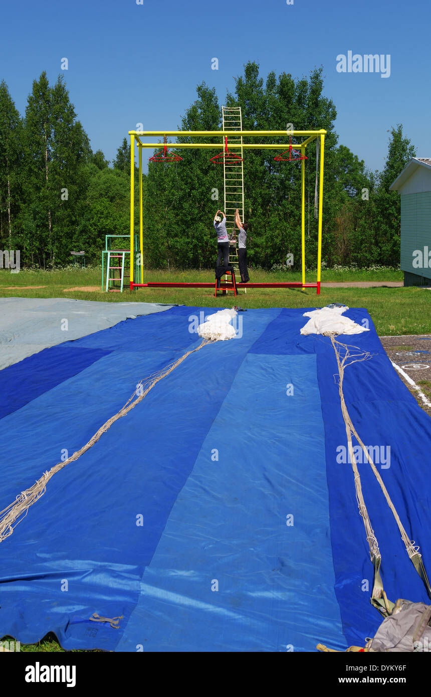 One day with parachutist in airfield. Preparation for parachute ...