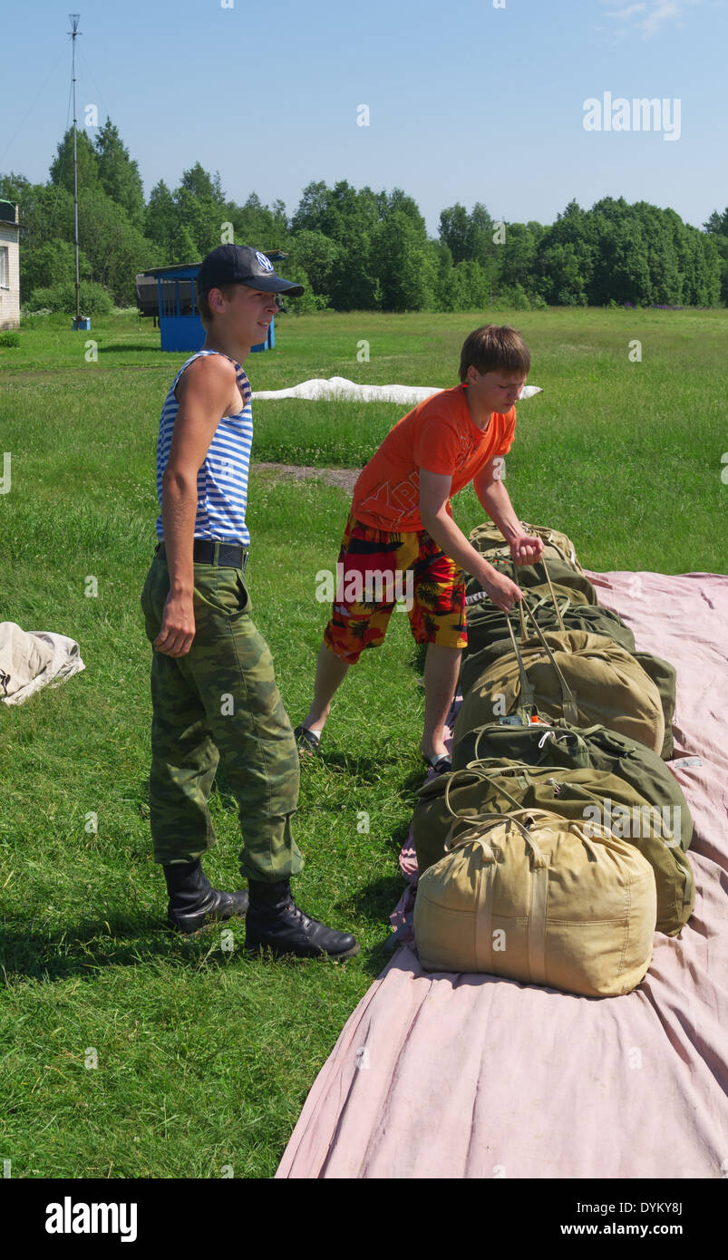 One day with parachutist in airfield. The packed parachutes Stock Photo ...