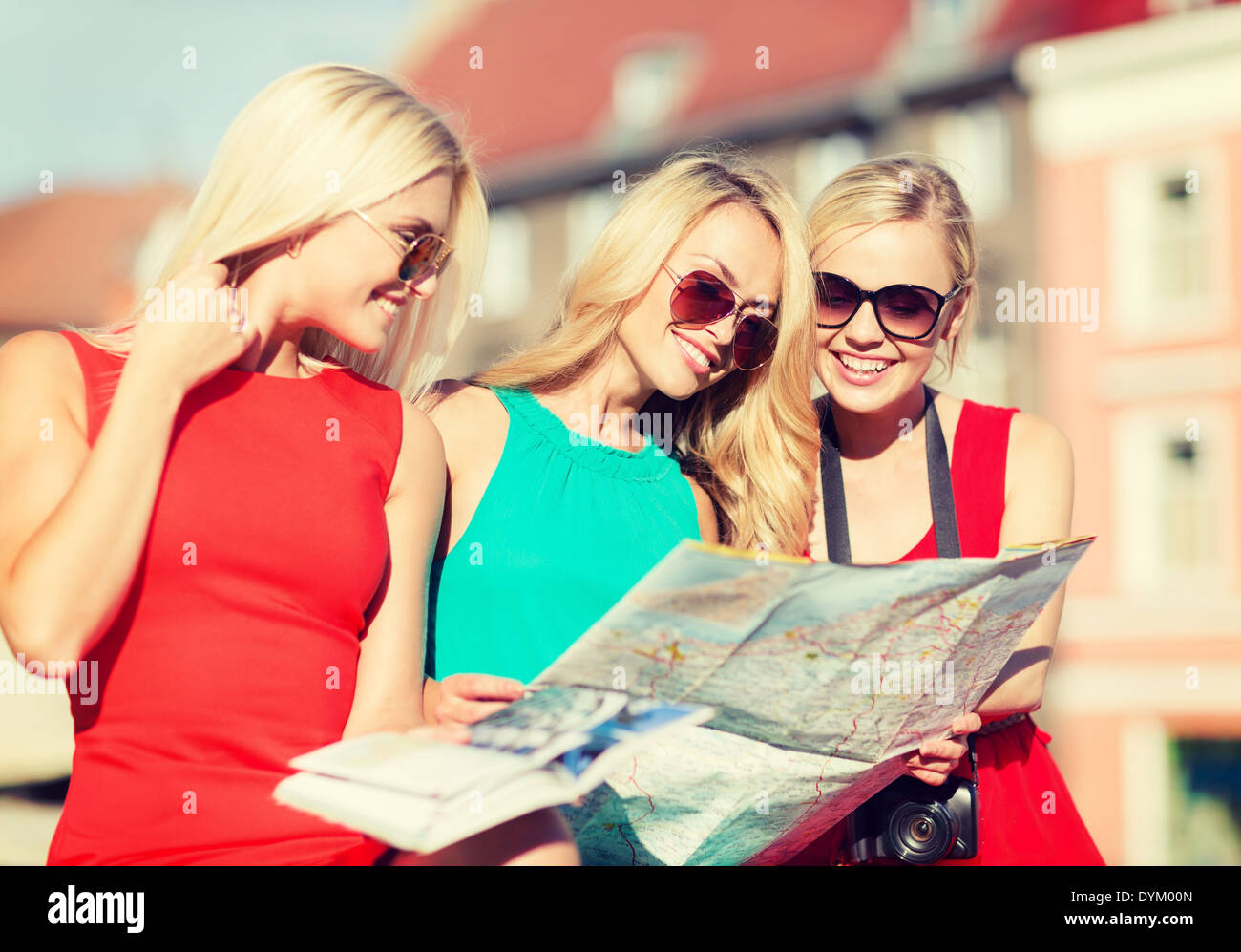 beautiful women with tourist map in the city Stock Photo - Alamy